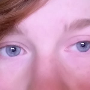 one eye slightly closed